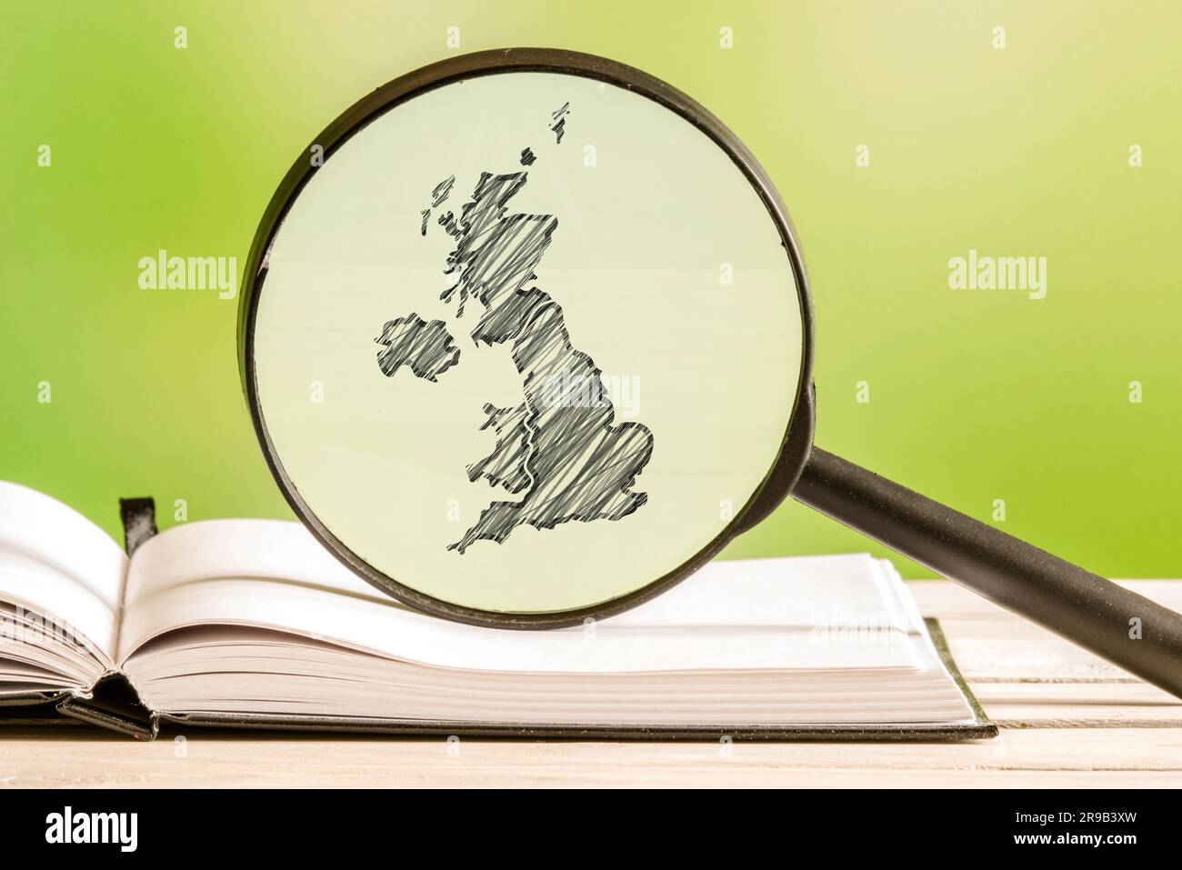 United Kingdom with a pencil drawing of a UK map in a magnifying glass ...