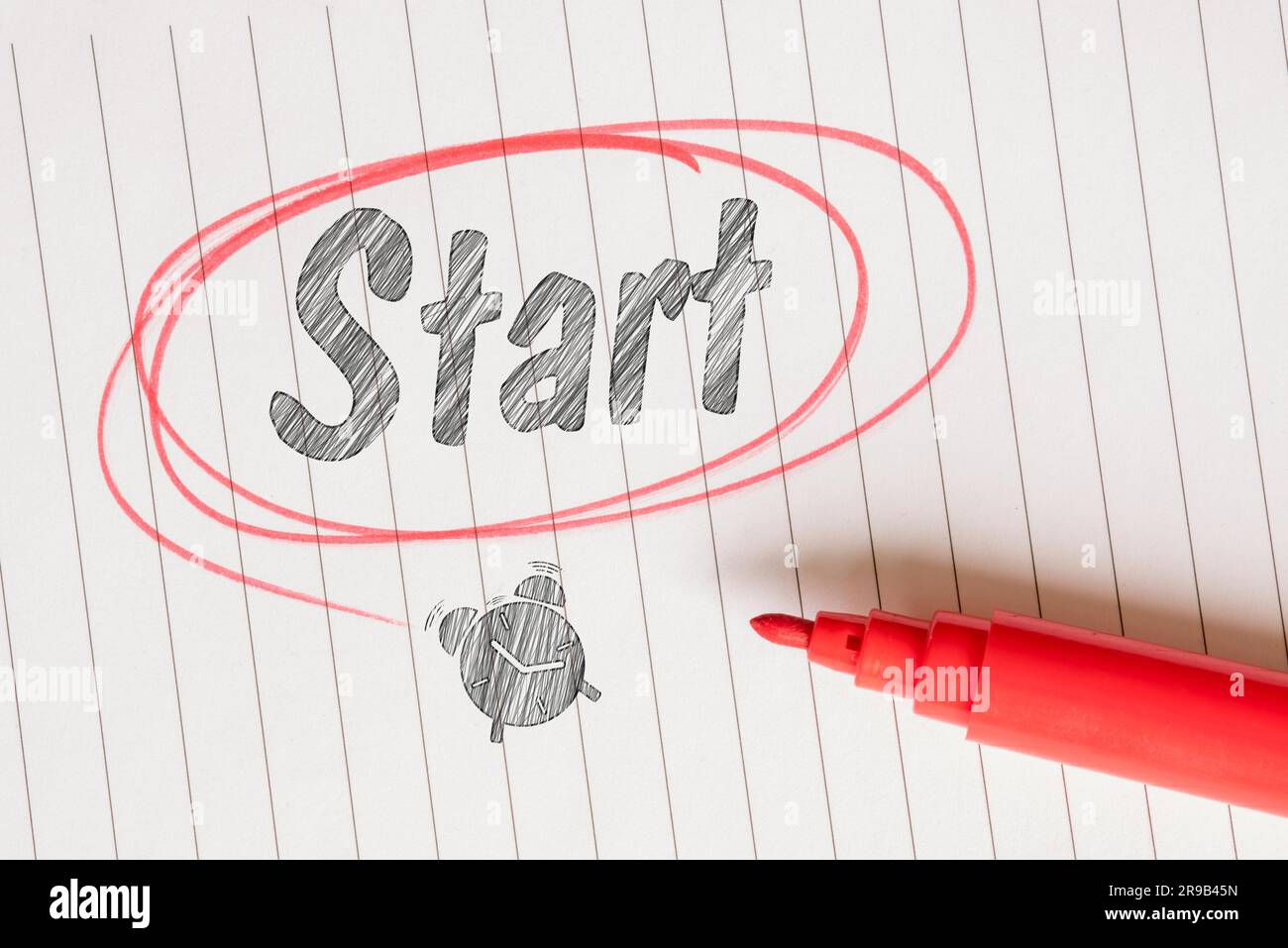 Start note with a red drawn circle and an alarm clock Stock Photo - Alamy