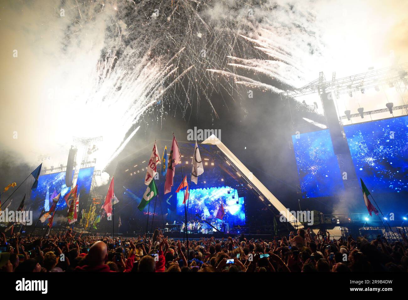 EDITORIAL USE ONLY Fireworks light up the sky as Elton John performs on ...