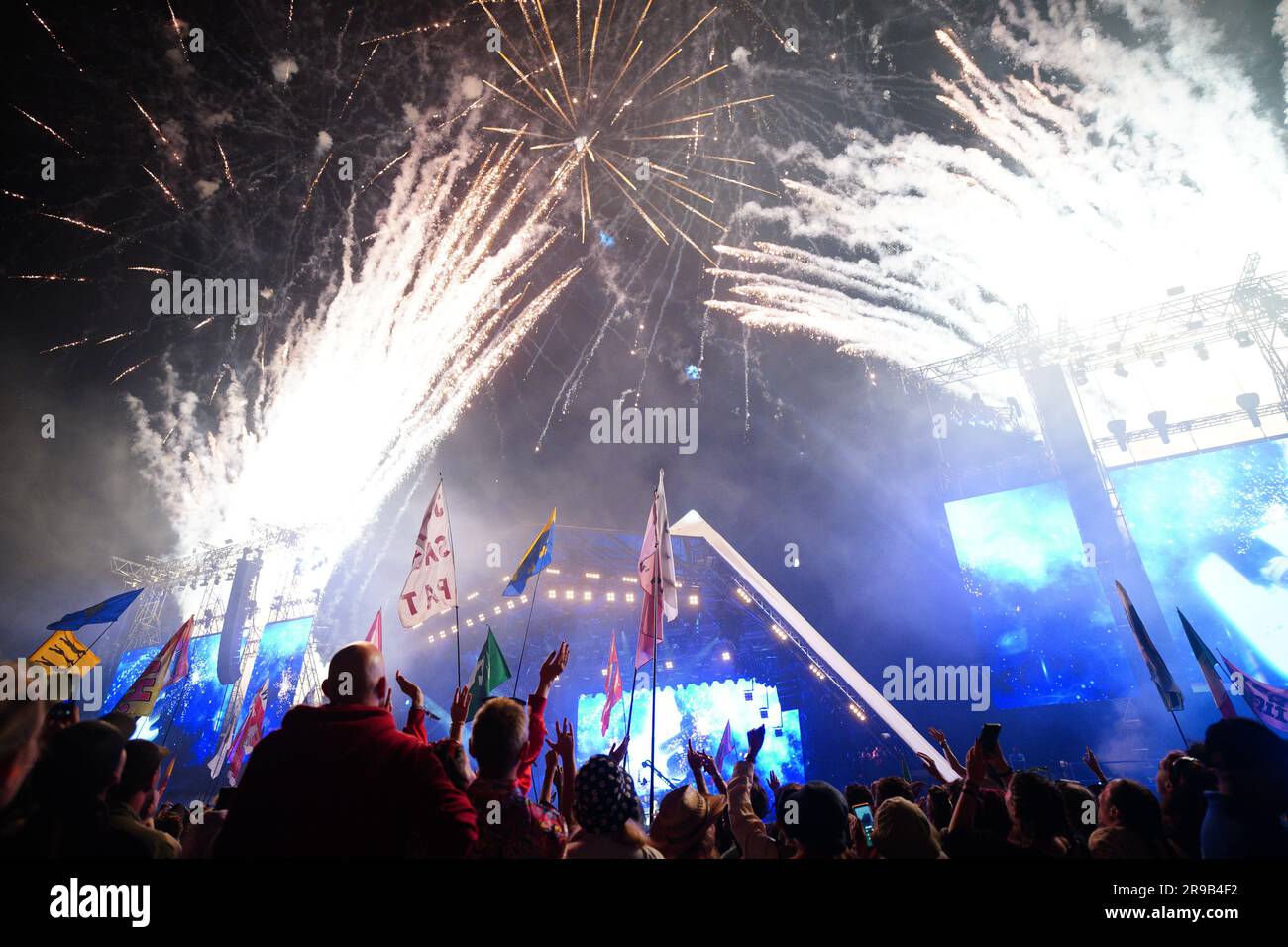 EDITORIAL USE ONLY Fireworks light up the sky as Elton John performs on ...