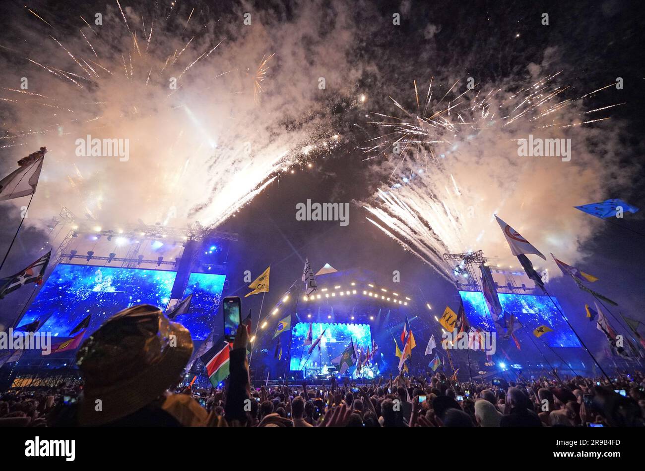 EDITORIAL USE ONLY Fireworks light up the sky as Elton John performs on ...