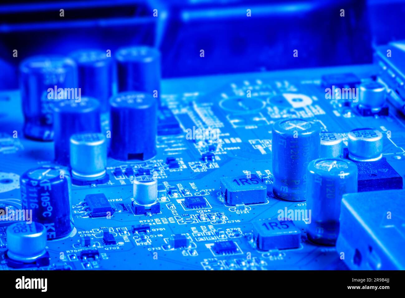 Electronic capacitors and chips on a microboard in blue color Stock ...
