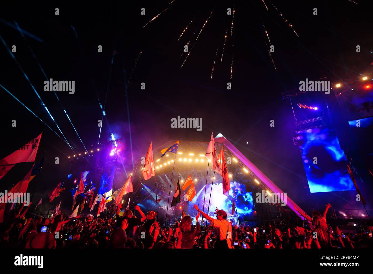 EDITORIAL USE ONLY Fireworks light up the sky as Elton John performs on ...