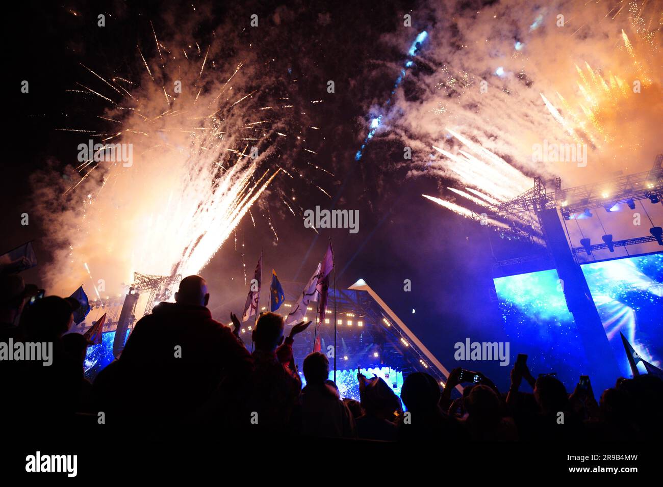 EDITORIAL USE ONLY Fireworks light up the sky as Elton John performs on ...