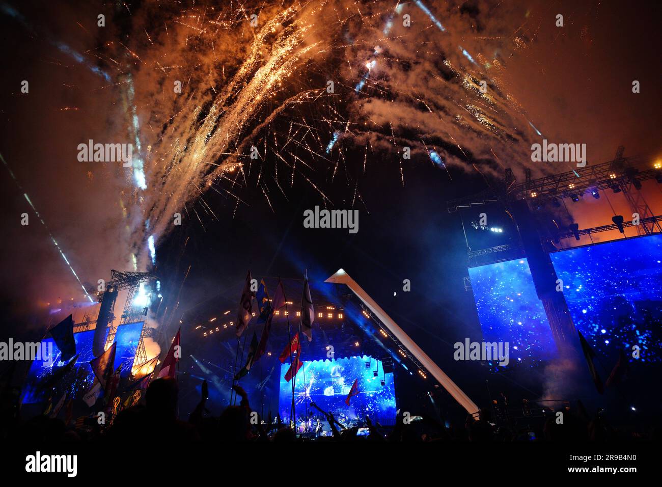 EDITORIAL USE ONLY Fireworks light up the sky as Elton John performs on ...