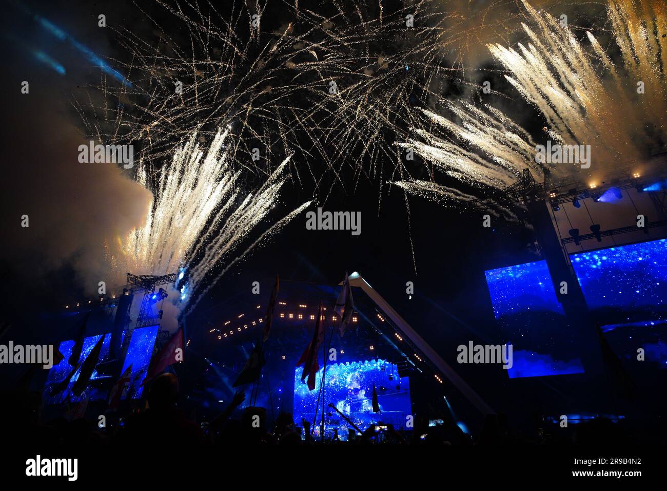 EDITORIAL USE ONLY Fireworks light up the sky as Elton John performs on ...
