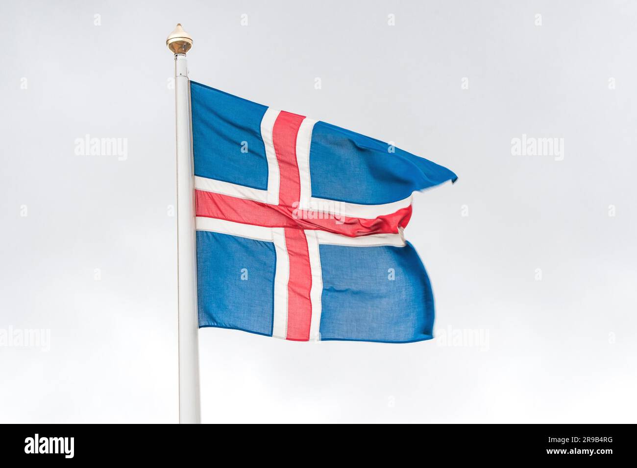 Iceland flag in the wind on a pole Stock Photo - Alamy