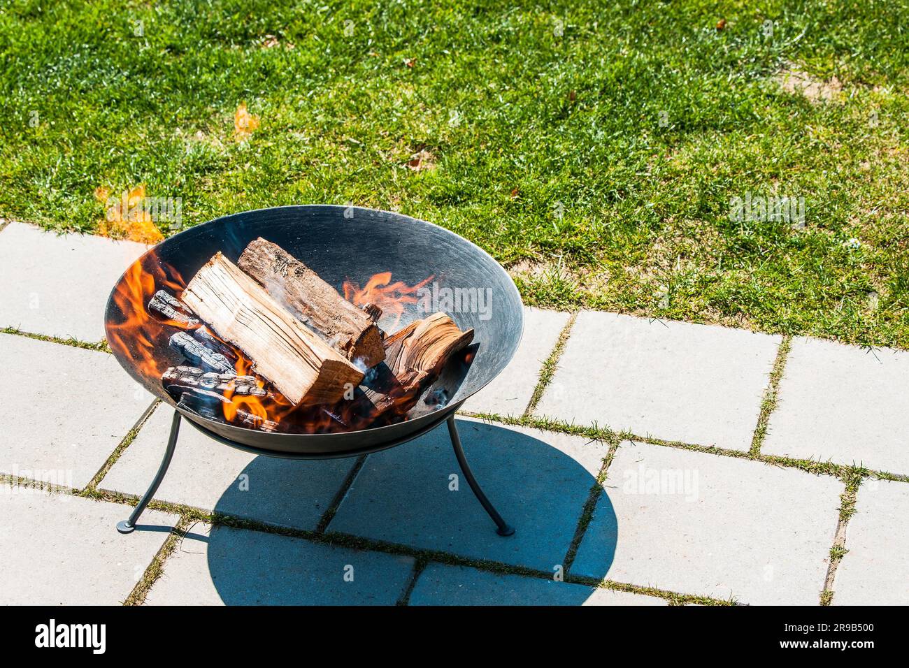Fireplace in a garden terrace in the summer Stock Photo - Alamy