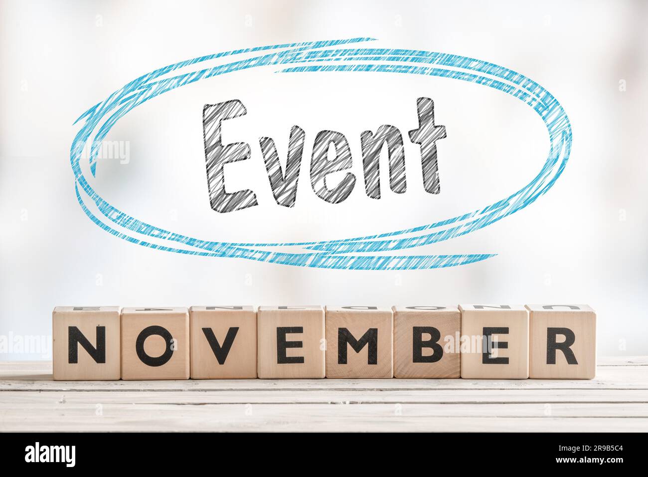 November event sign with wooden blocks on a stage Stock Photo - Alamy