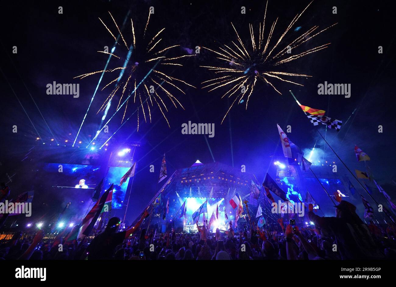 EDITORIAL USE ONLY Fireworks light up the sky as Elton John performs on ...