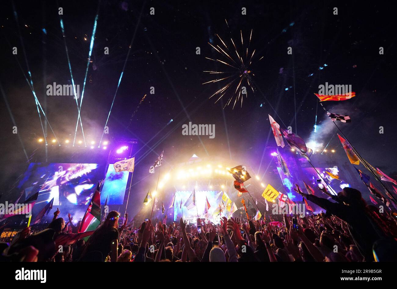 EDITORIAL USE ONLY Fireworks light up the sky as Elton John performs on ...