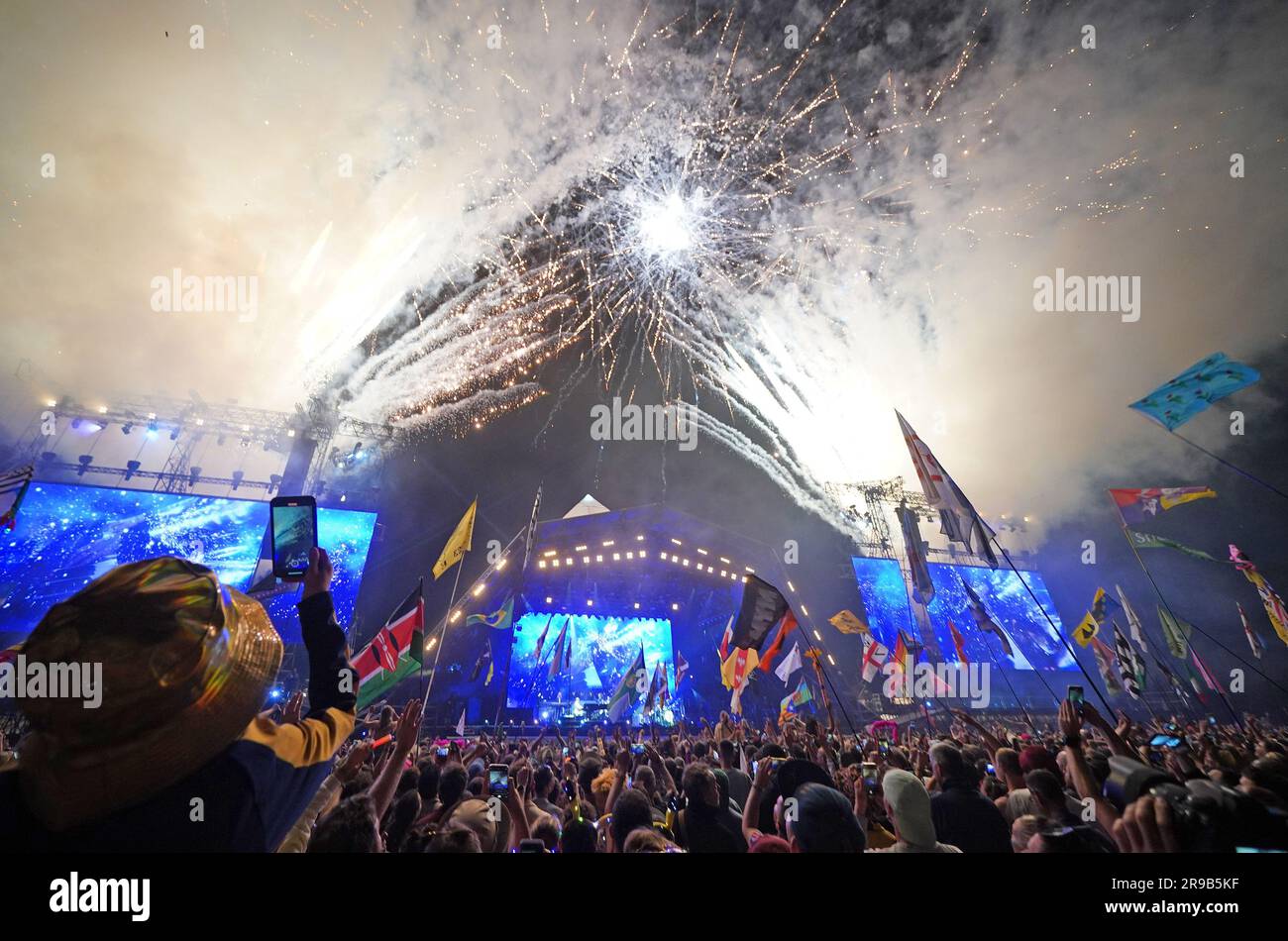 EDITORIAL USE ONLY Fireworks light up the sky as Elton John performs on ...