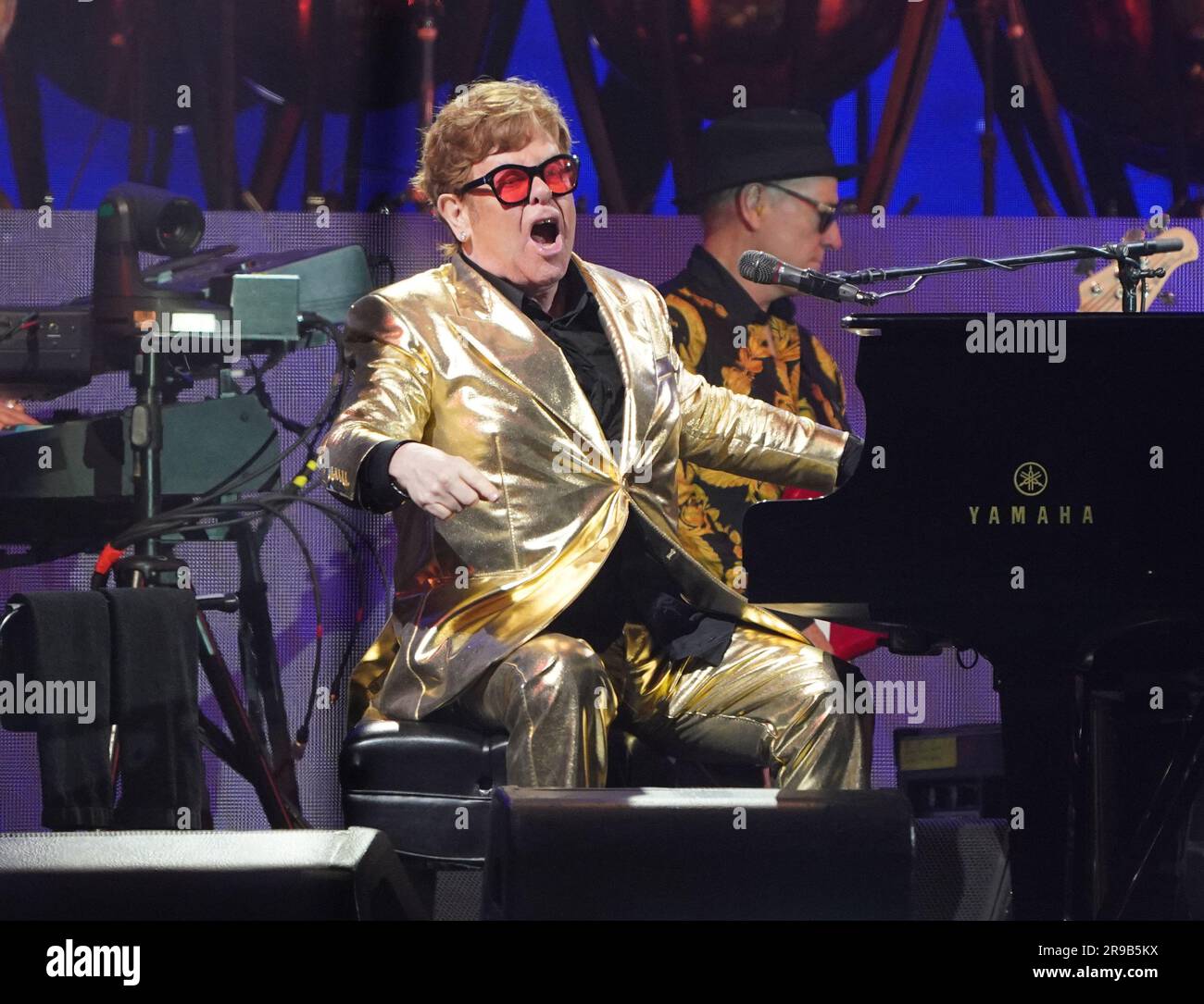 EDITORIAL USE ONLY Elton John performing on the Pyramid Stage at the ...