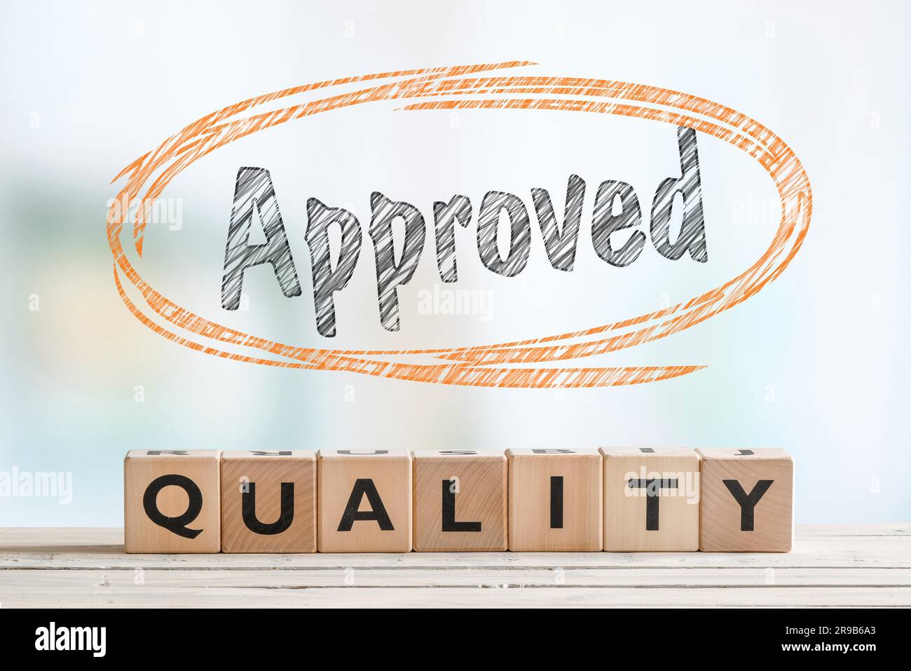 Approved quality sign on a desk in a bright room Stock Photo - Alamy