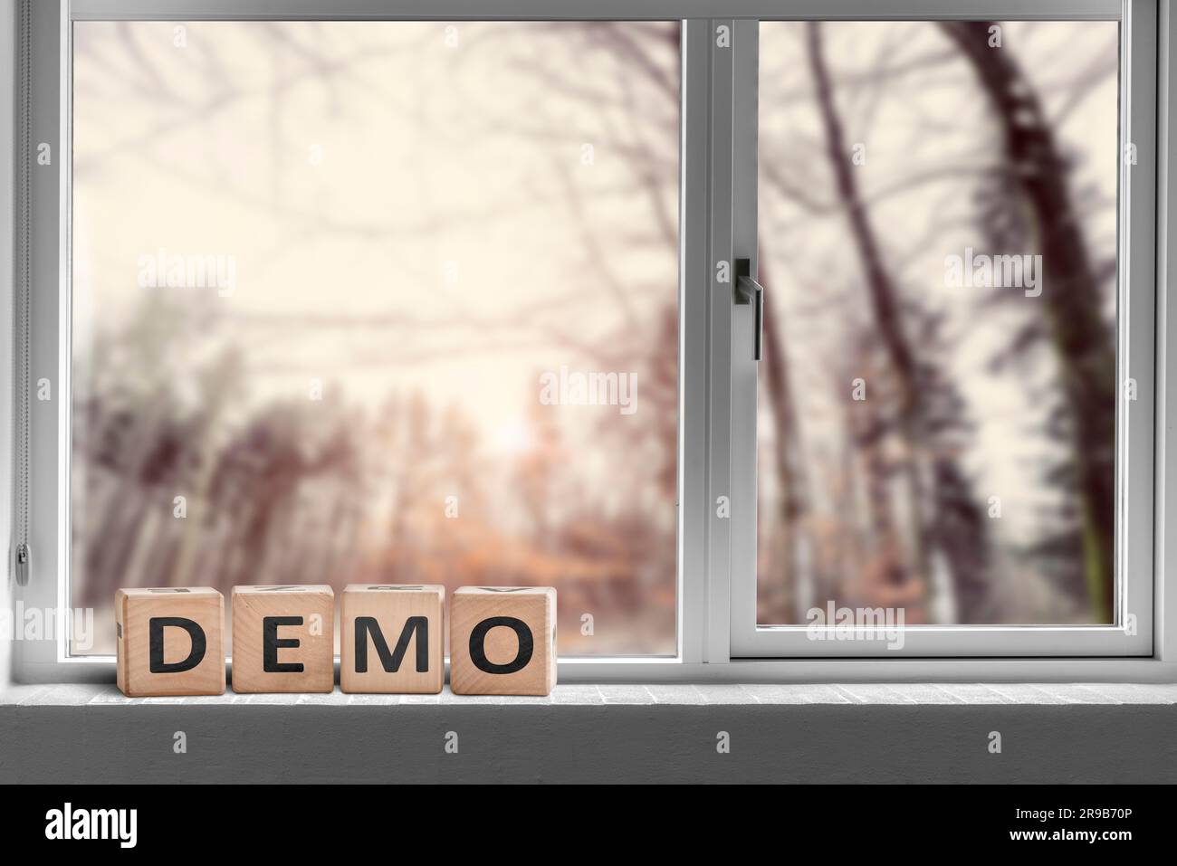Demo sign in a window with a view to a forest in the morning Stock ...