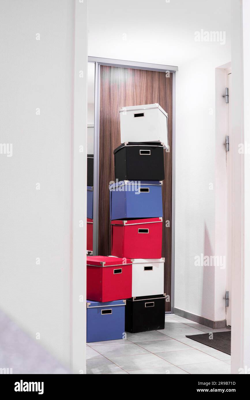 Stacked boxes in various colors in a bright room in a doorway Stock ...