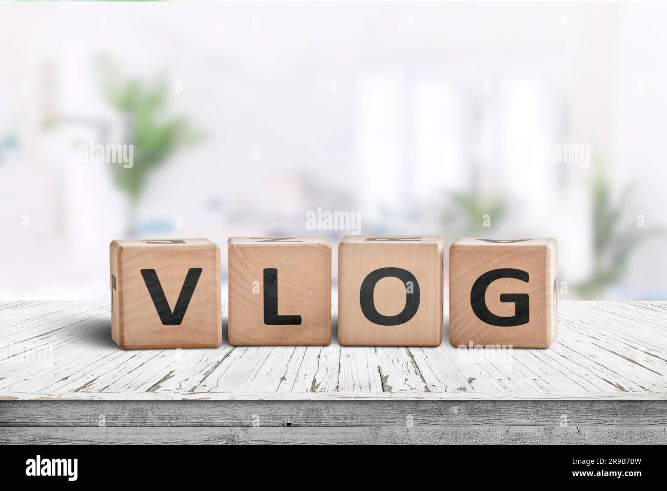 Vlog sign on a desk in a bright living room in the middle of the day ...