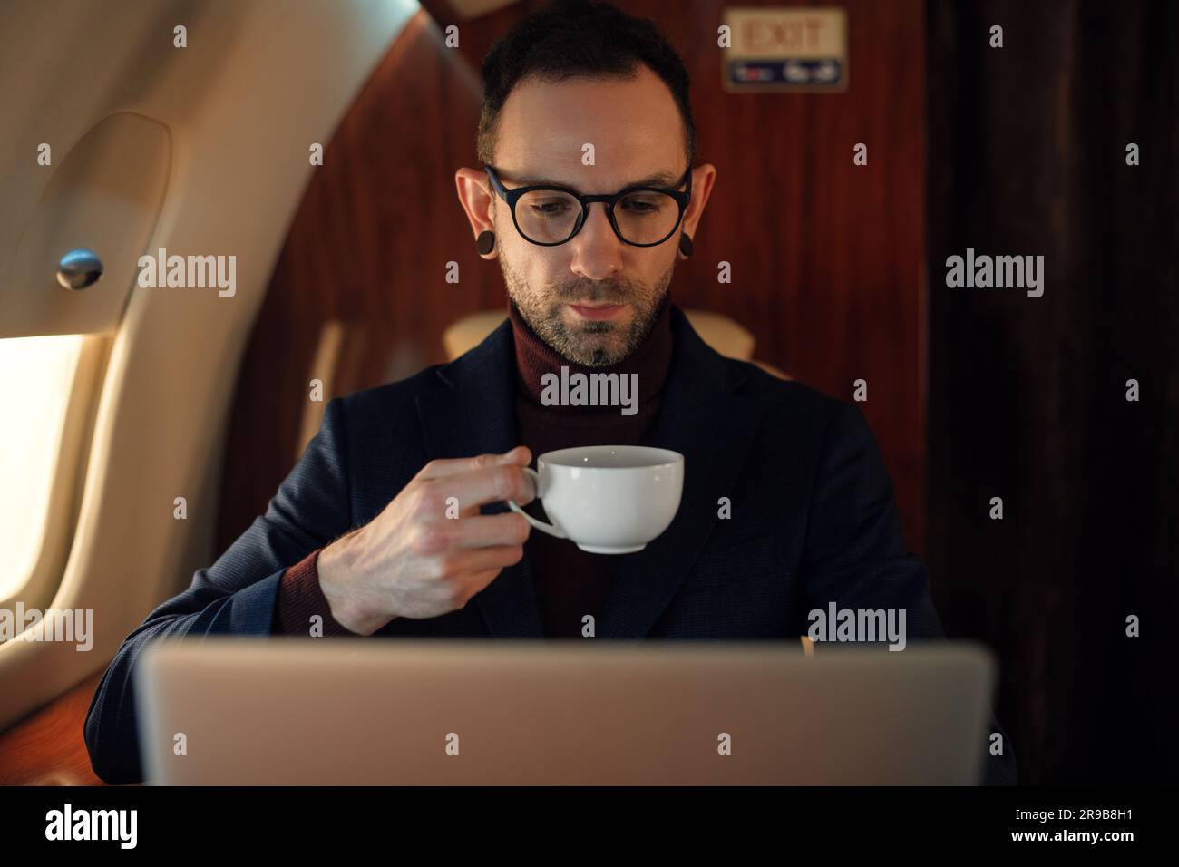 Elegant Young CEO businessman in eyeglasses man sitting inside a ...