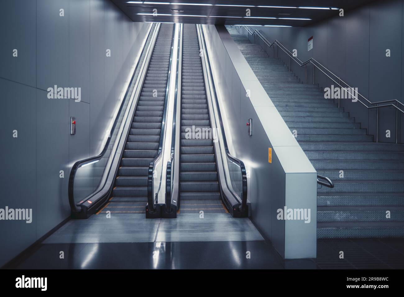 In Barcelona, Illuminated escalators on the left and wide, sloping ...