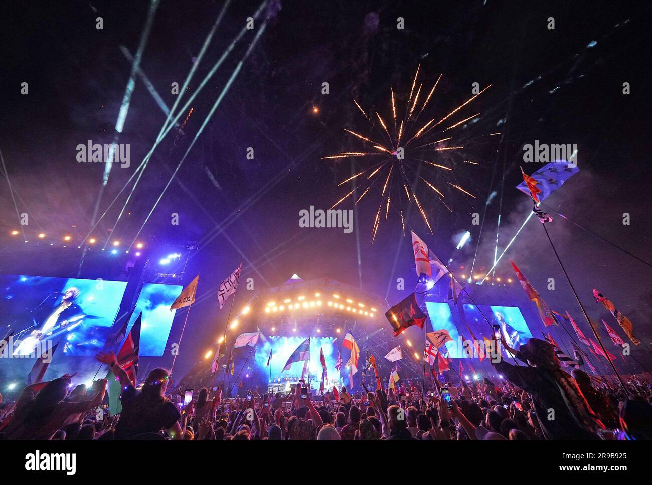 EDITORIAL USE ONLY Fireworks light up the sky as Elton John performs on ...