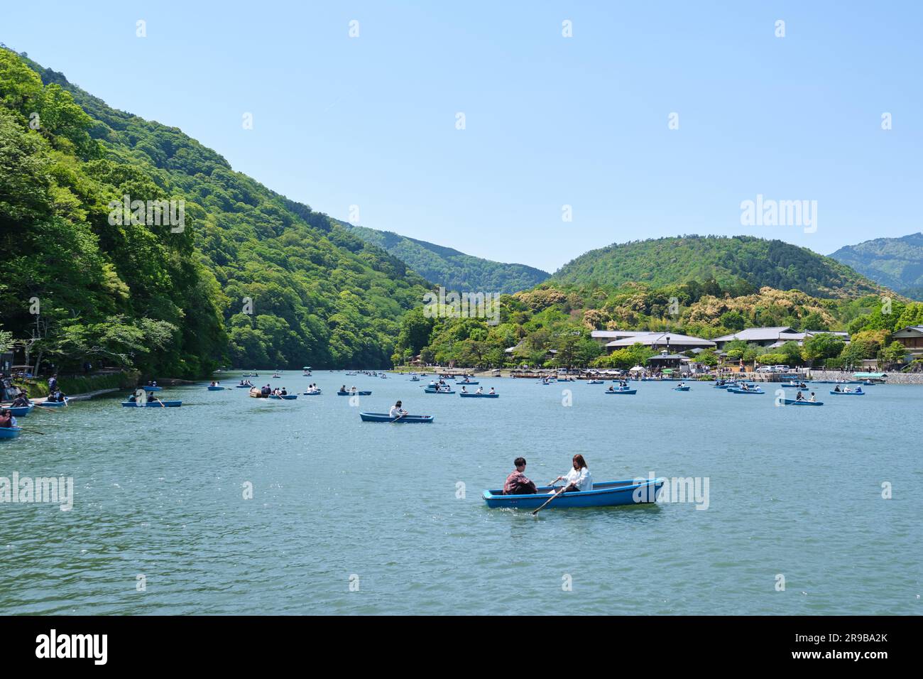 Landscape of people in rowing boats on Katsura River in Arashiyama ...