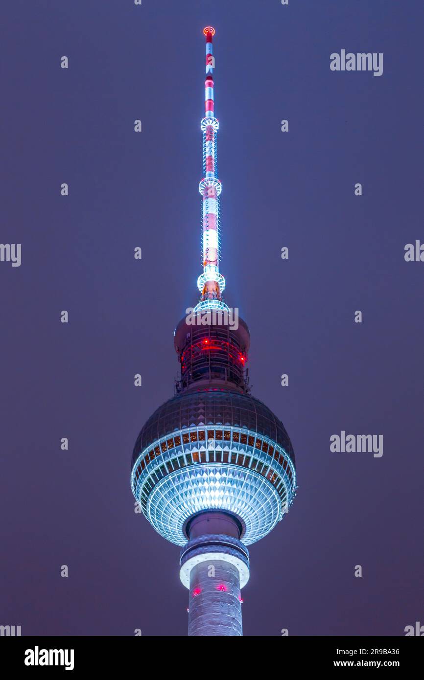 Berlin Television Tower or Berliner Fernsehturm at night. The iconic ...