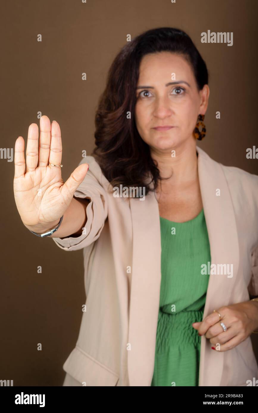 Portrait smiling and confident coaching woman making hand gestures ...