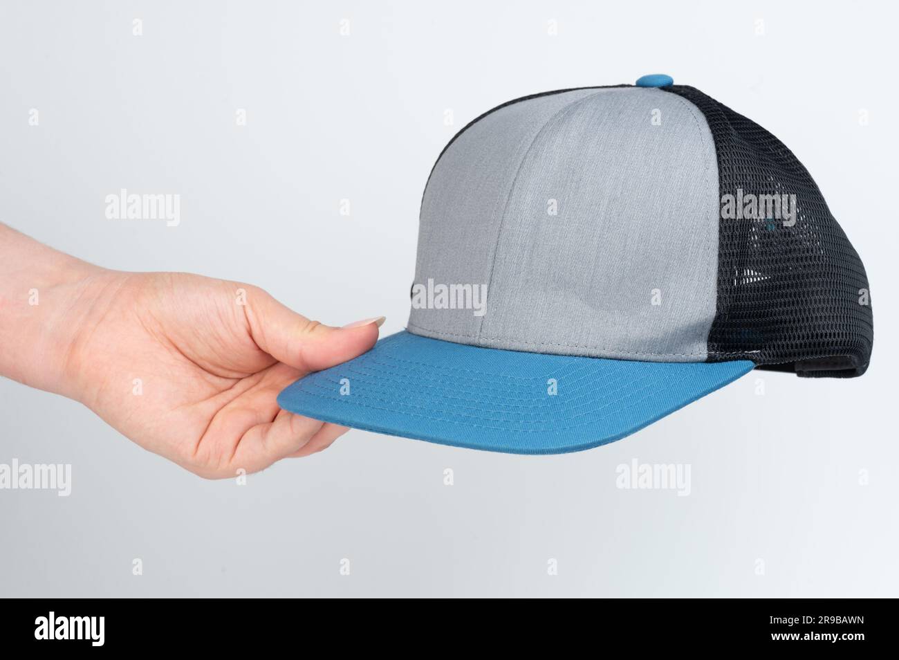 Baseball cap with mesh back in hand front view isolated Stock Photo - Alamy