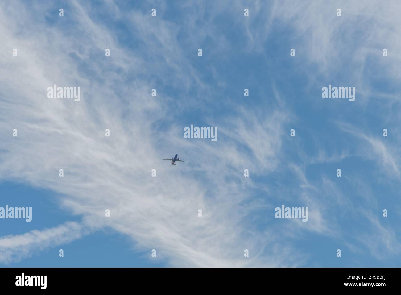 Airplane soaring through clear blue hi-res stock photography and images ...