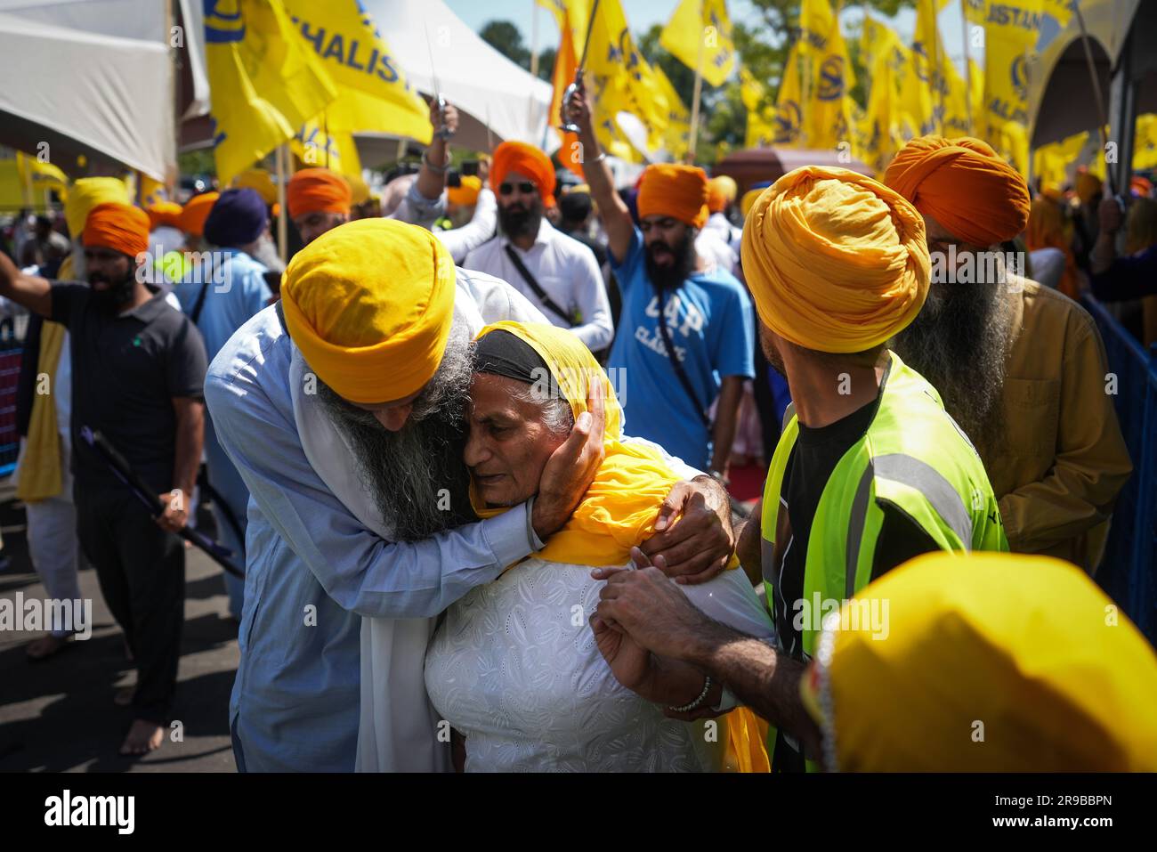 Surrey, Canada. 25th June, 2023. A woman is consoled as people mourn Sikh community leader and ...