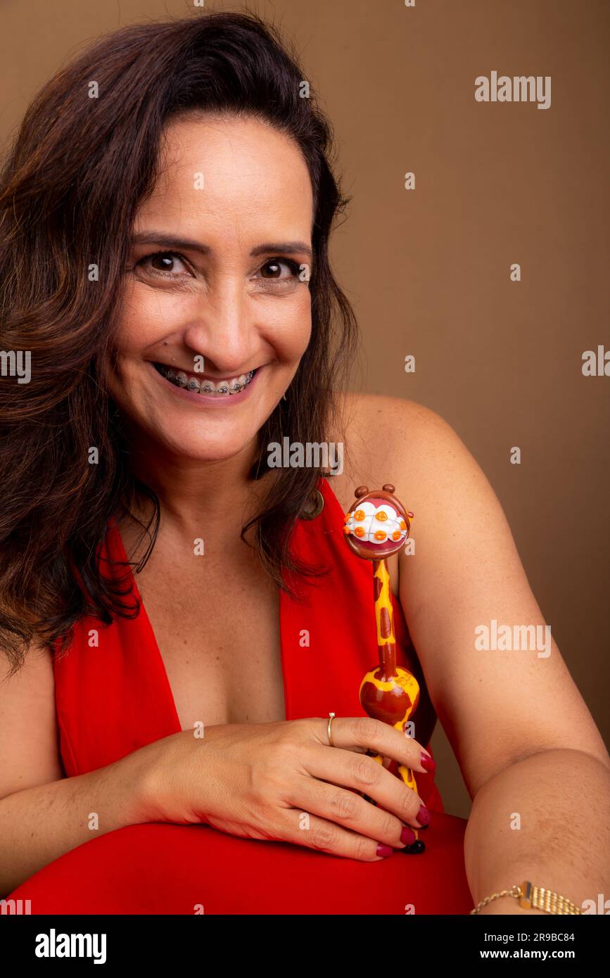 Cheerful coaching woman with a giraffe puppet. Symbol of non-violent ...