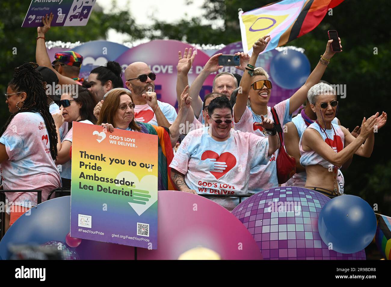 New York, USA. 25th June, 2023. Actress Lea DeLaria (2-r) rides on a ...