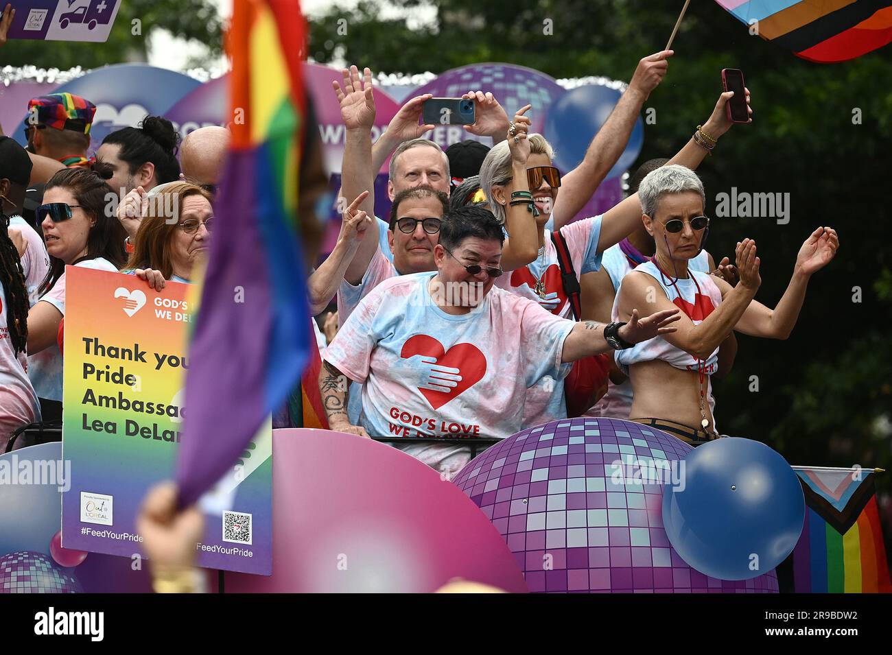New York, USA. 25th June, 2023. Actress Lea DeLaria (2-r) rides on a ...