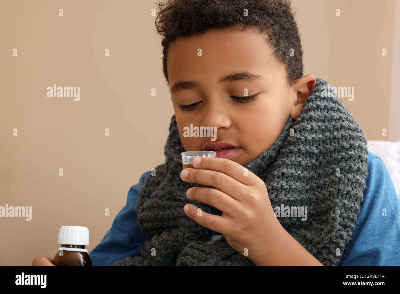 Boy taking medicine hi-res stock photography and images - Alamy