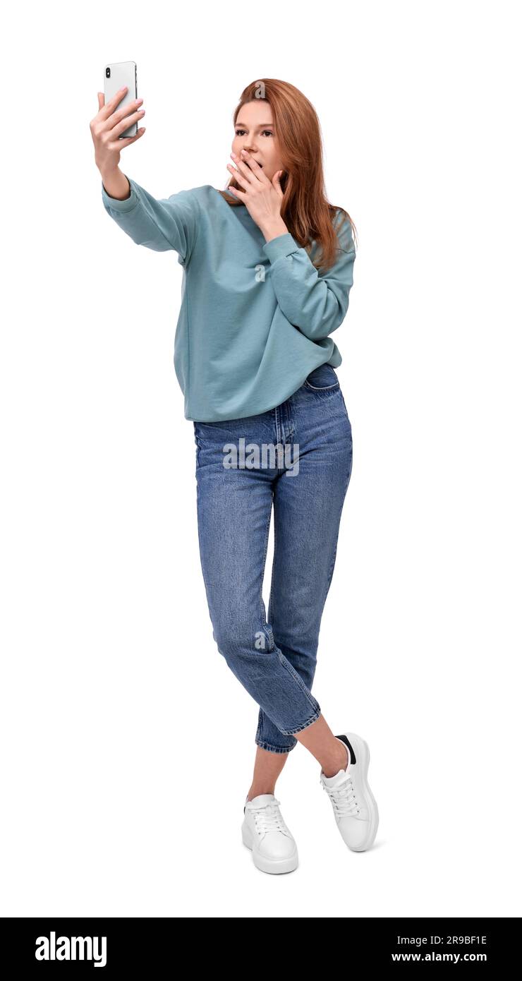 Beautiful woman taking selfie on white background Stock Photo - Alamy