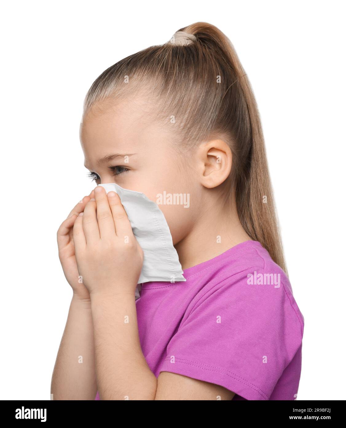 Sick girl blowing nose in tissue on white background. Cold symptoms ...