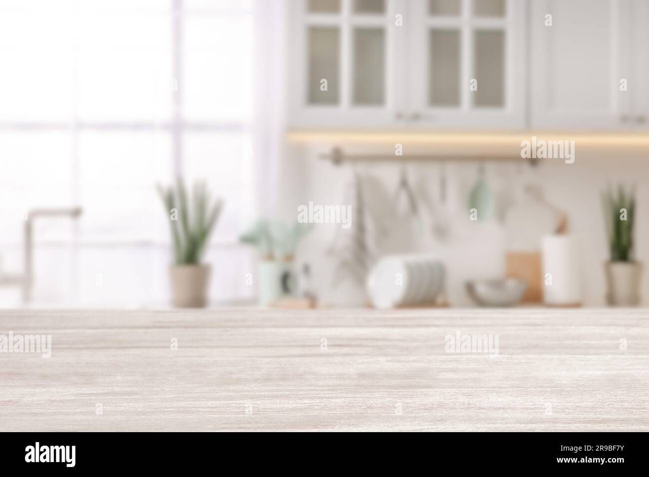 Empty white wooden table in beautiful kitchen. Space for design Stock ...