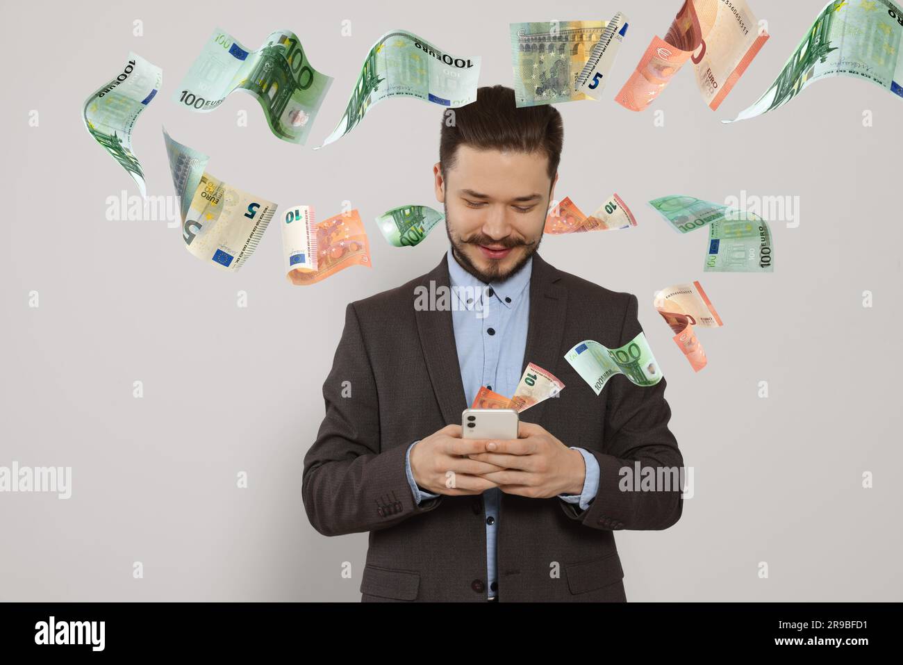 Online payment. Man buying something using mobile phone on light grey ...