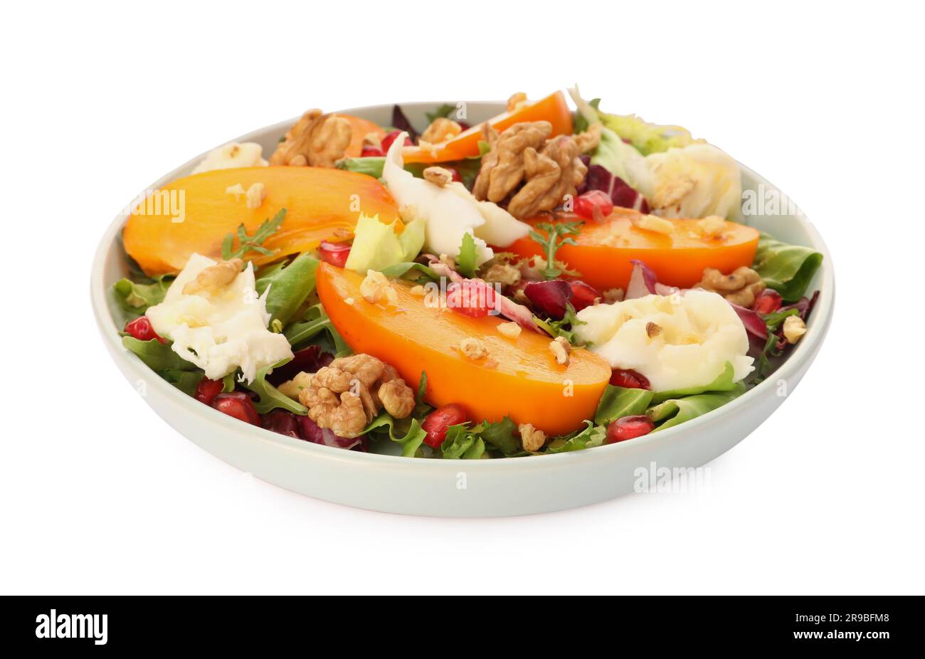 Cut persimmon on plate hi-res stock photography and images - Alamy