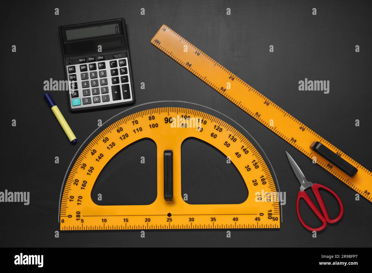 Flat lay composition with protractor and ruler on black table Stock ...