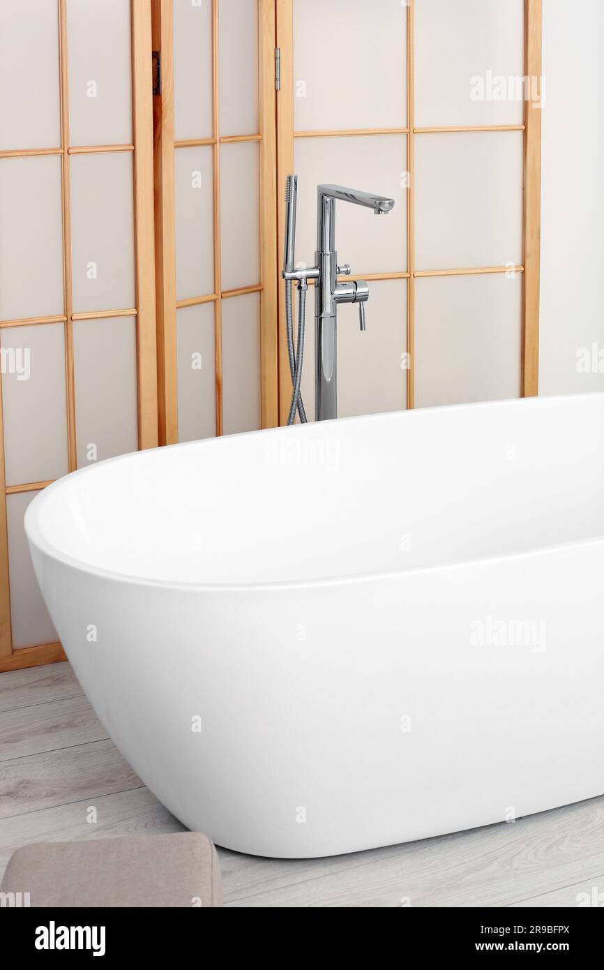 White ceramic tub in bathroom. Interior design Stock Photo - Alamy