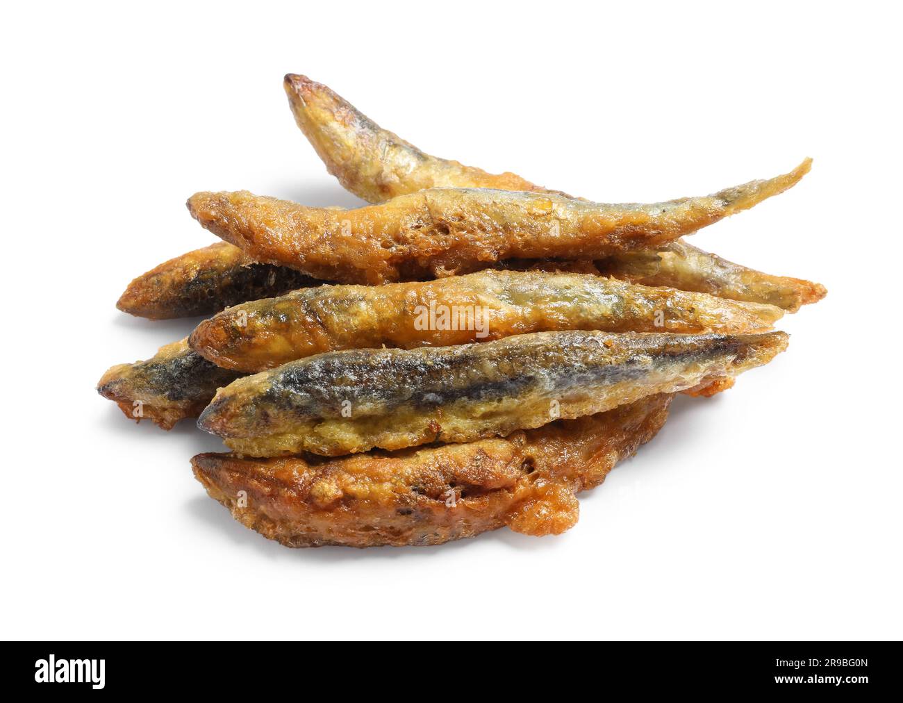 Pile of delicious fried anchovies on white background Stock Photo - Alamy