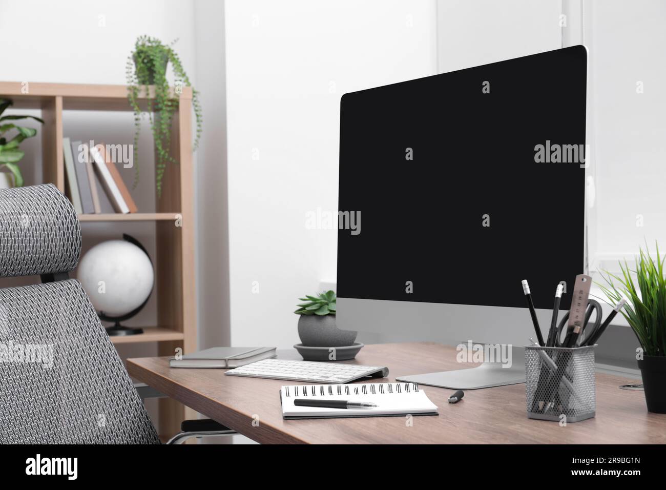 Cosy workspace with computer on desk at home Stock Photo - Alamy