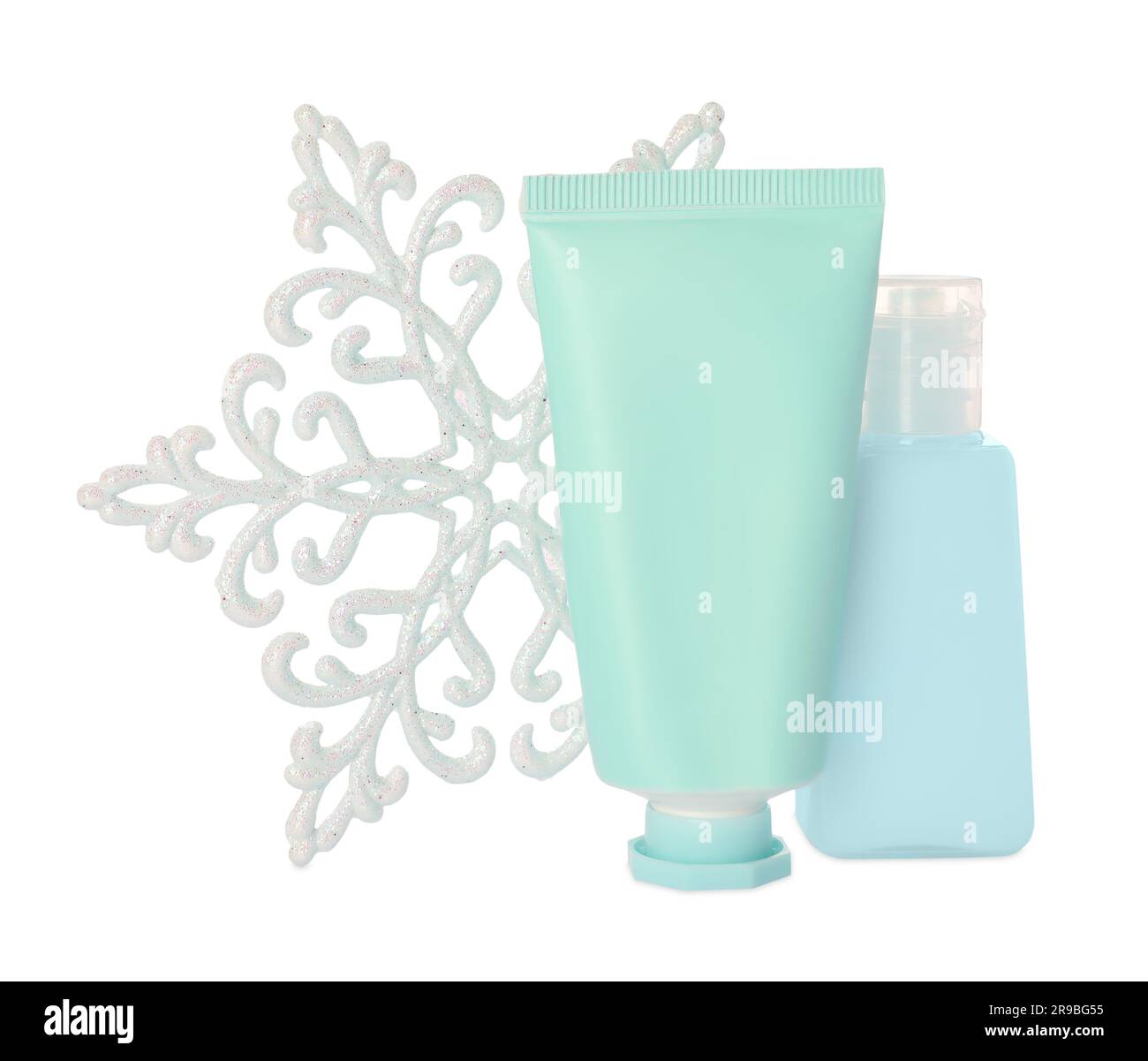 Set of cosmetic products with hand cream and snowflake isolated on ...