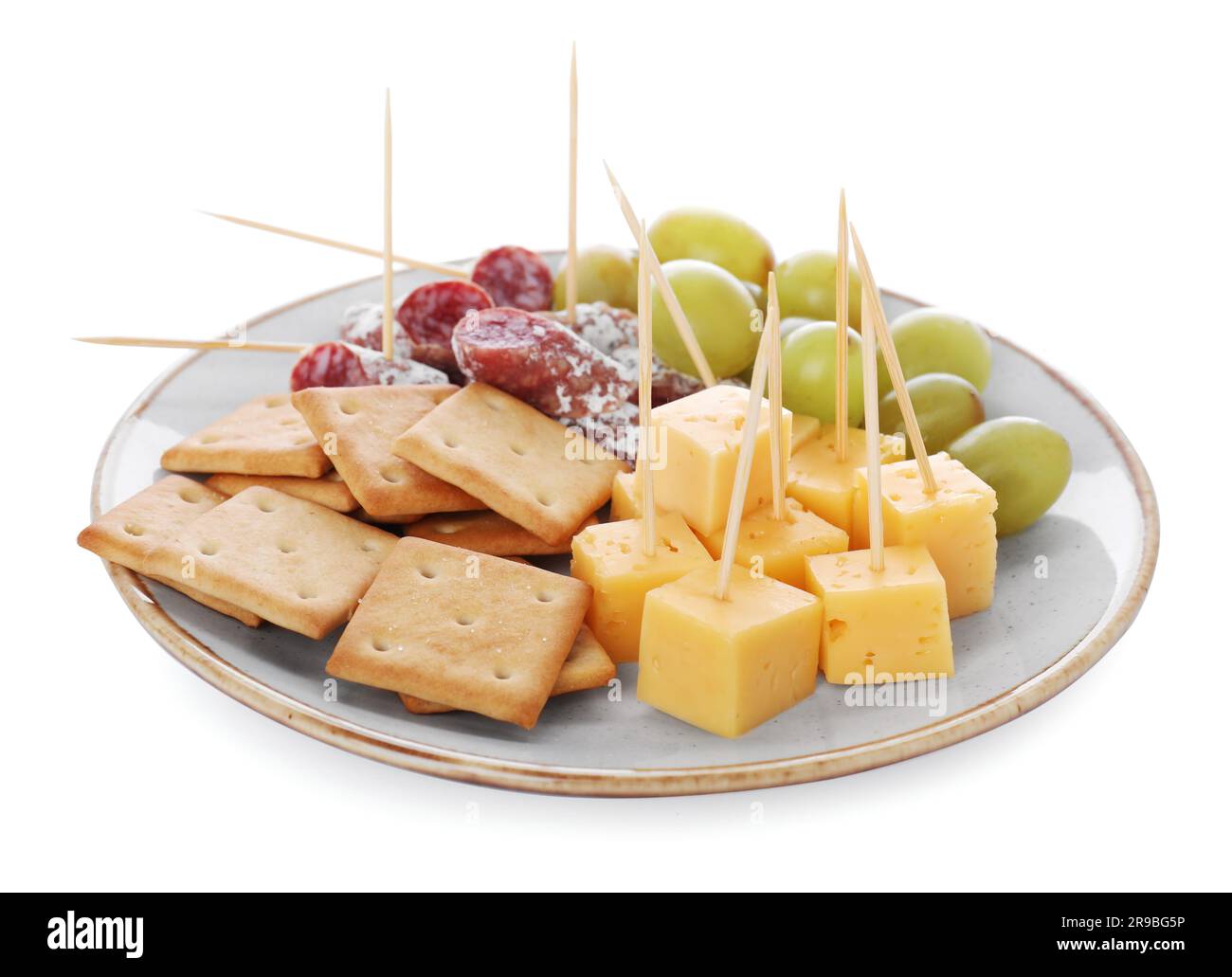 Toothpick appetizers. Tasty cheese, sausage, crackers and grapes on ...
