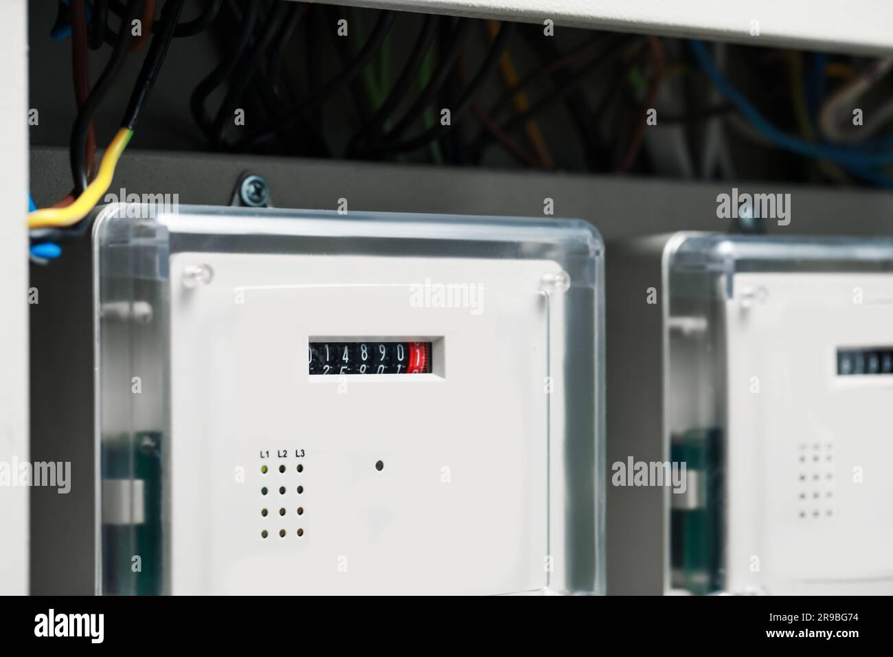 Electric meters and wires in fuse box, closeup Stock Photo - Alamy