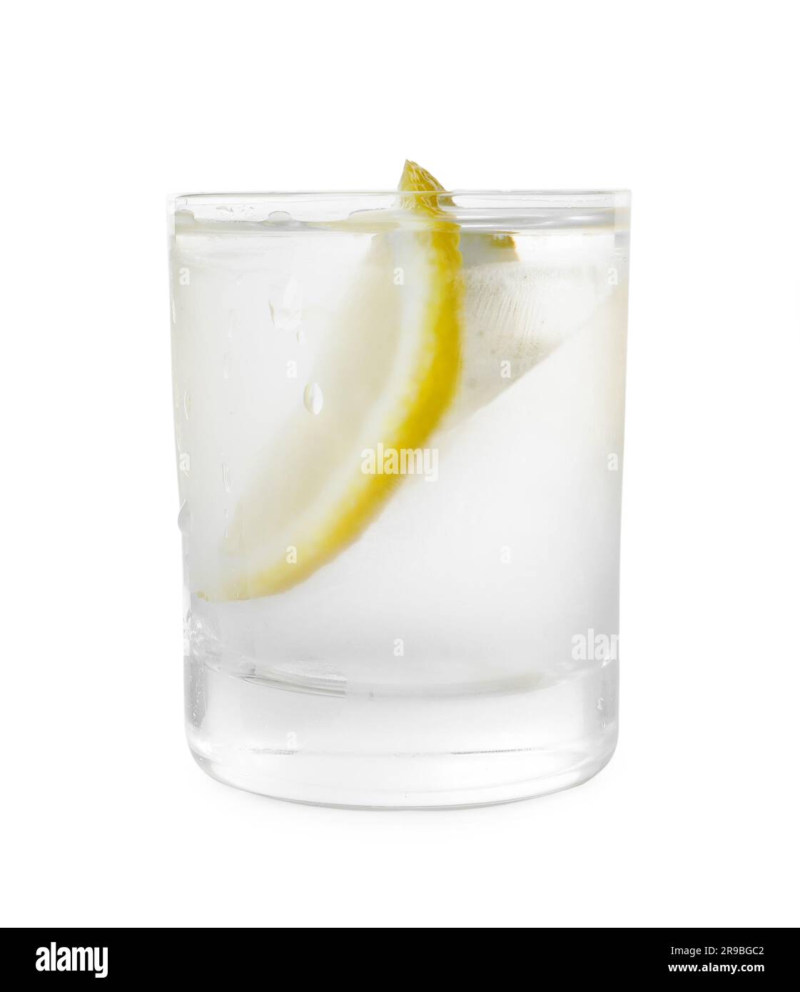 Glass of vodka with lemon isolated on white Stock Photo - Alamy