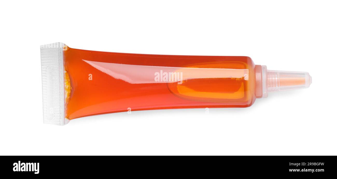 Tube with orange food coloring isolated on white, top view Stock Photo ...