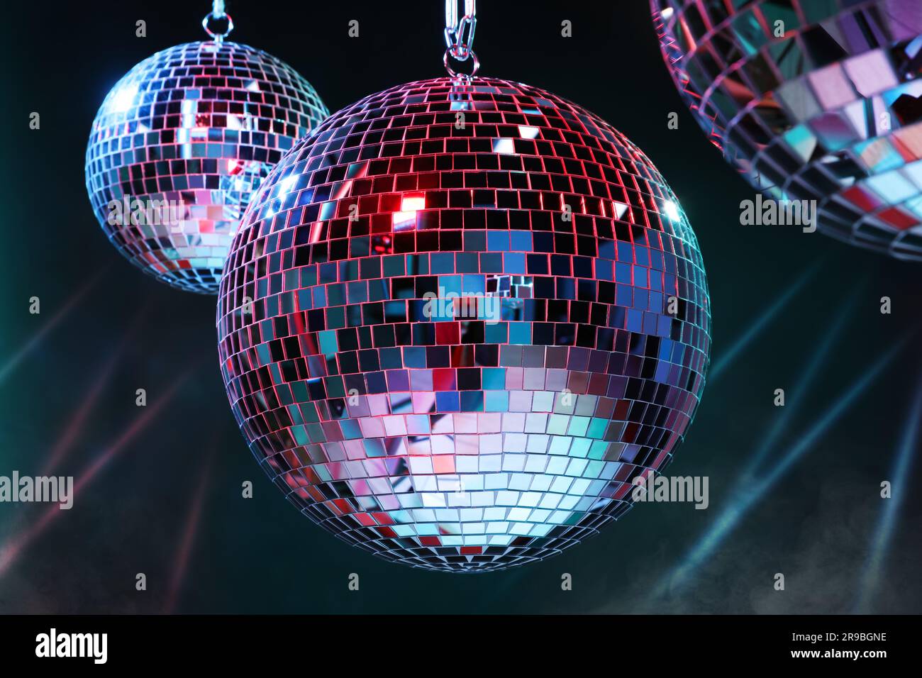 Bright shiny disco balls on dark background Stock Photo - Alamy