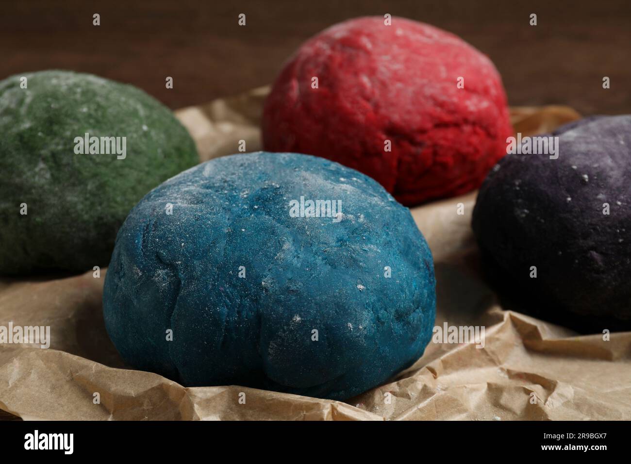 Dough painted with food colorings on table, closeup Stock Photo - Alamy